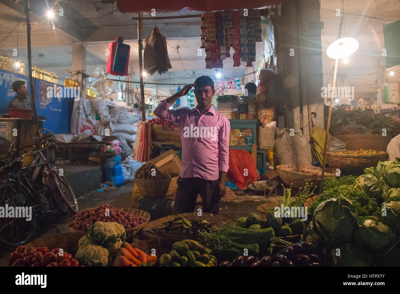 SRIMANGAL, BANGLADESH - FEBRUARY 2017: Man with a small shop selling ...