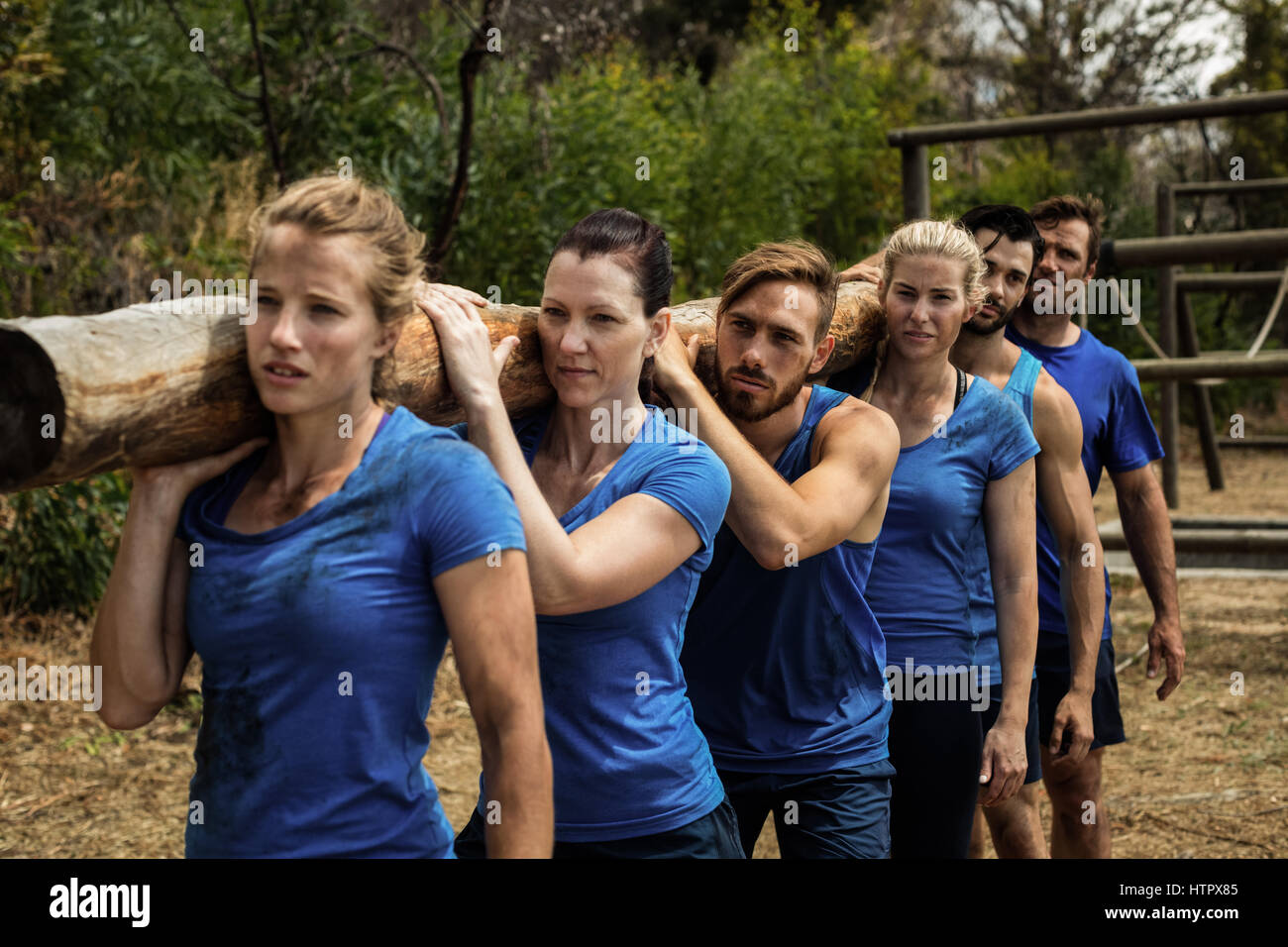 Woman lifting wooden log hi-res stock photography and images - Alamy