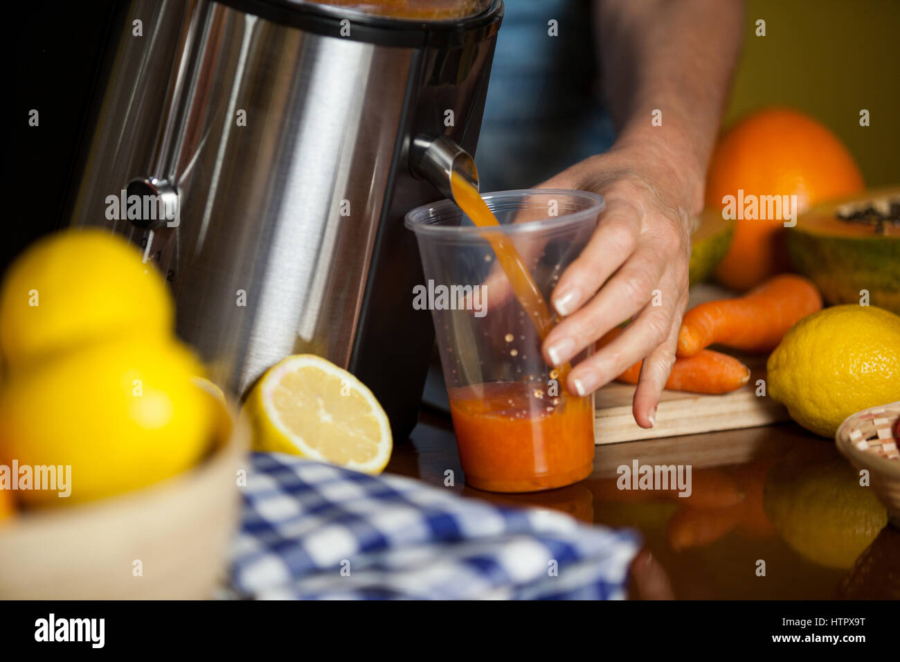 Female staff pouring juice hi-res stock photography and images - Alamy