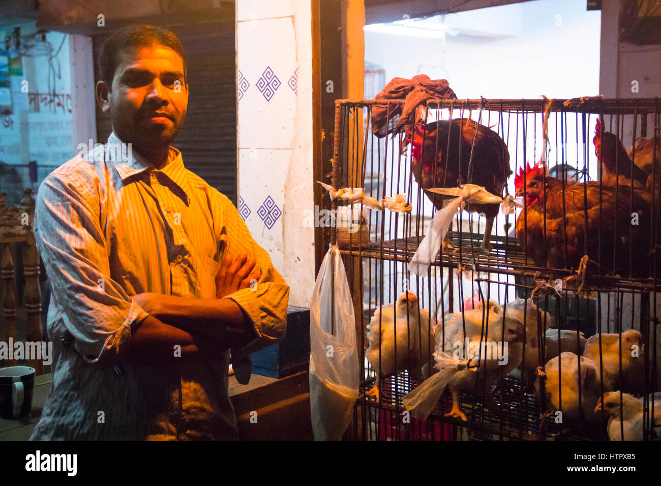 SRIMANGAL, BANGLADESH - FEBRUARY 2017: Man with a small shop selling ...