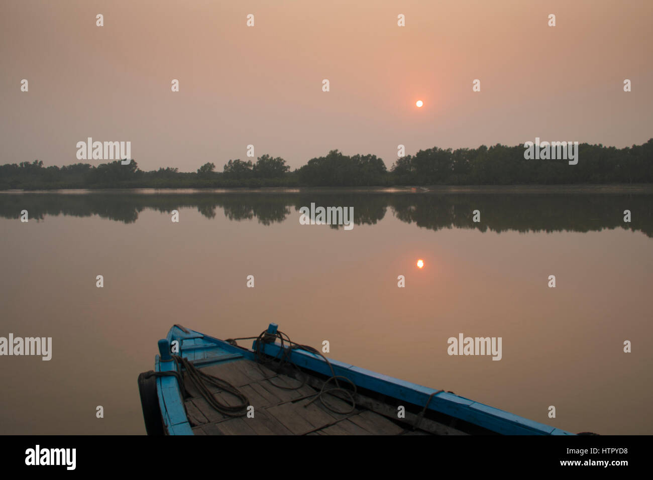 Sunset over the river in the Sundarbans national park, famous for its ...