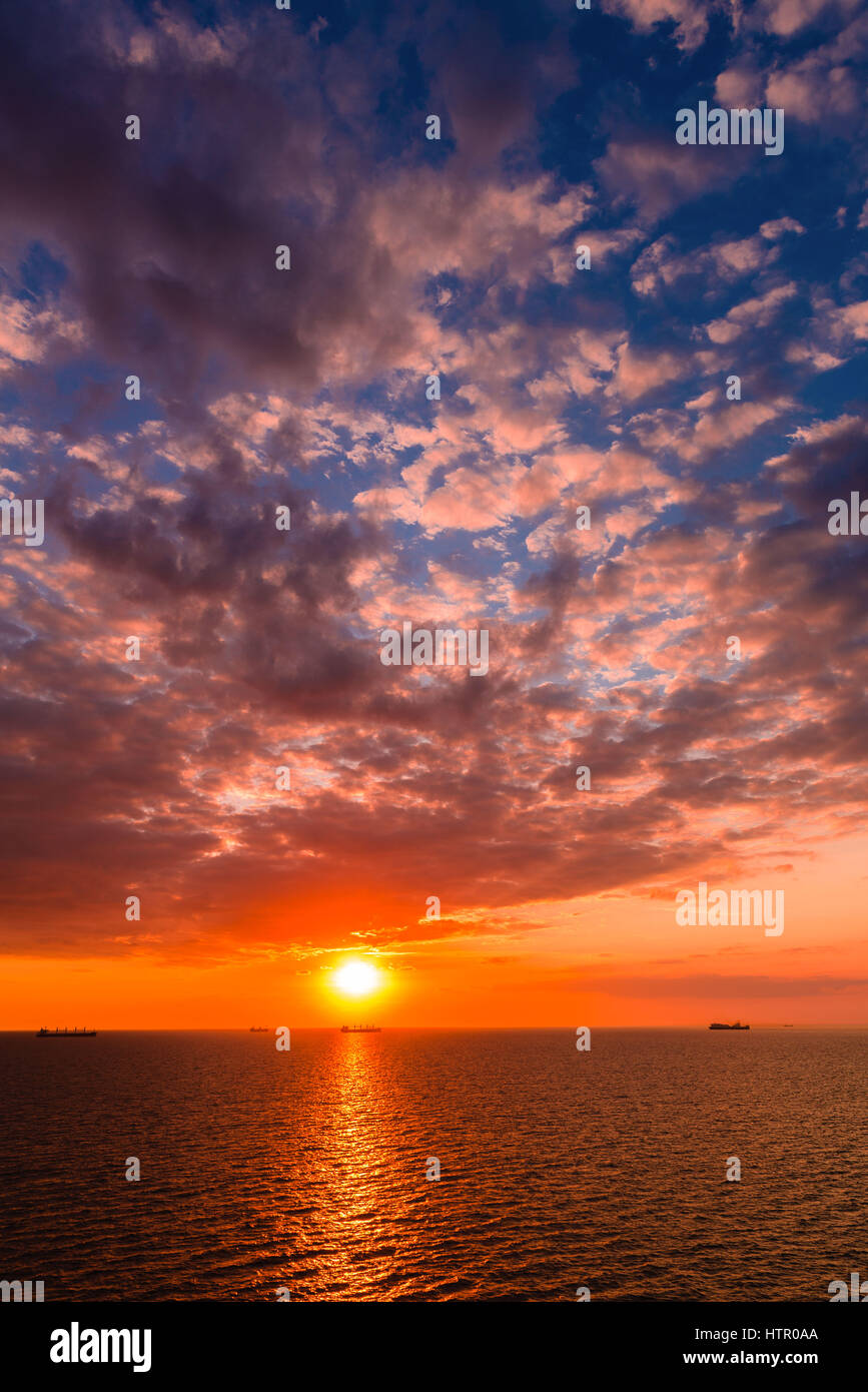 Ocean lane, colorful sunset and impressive evening clouds, Baltic Sea ...