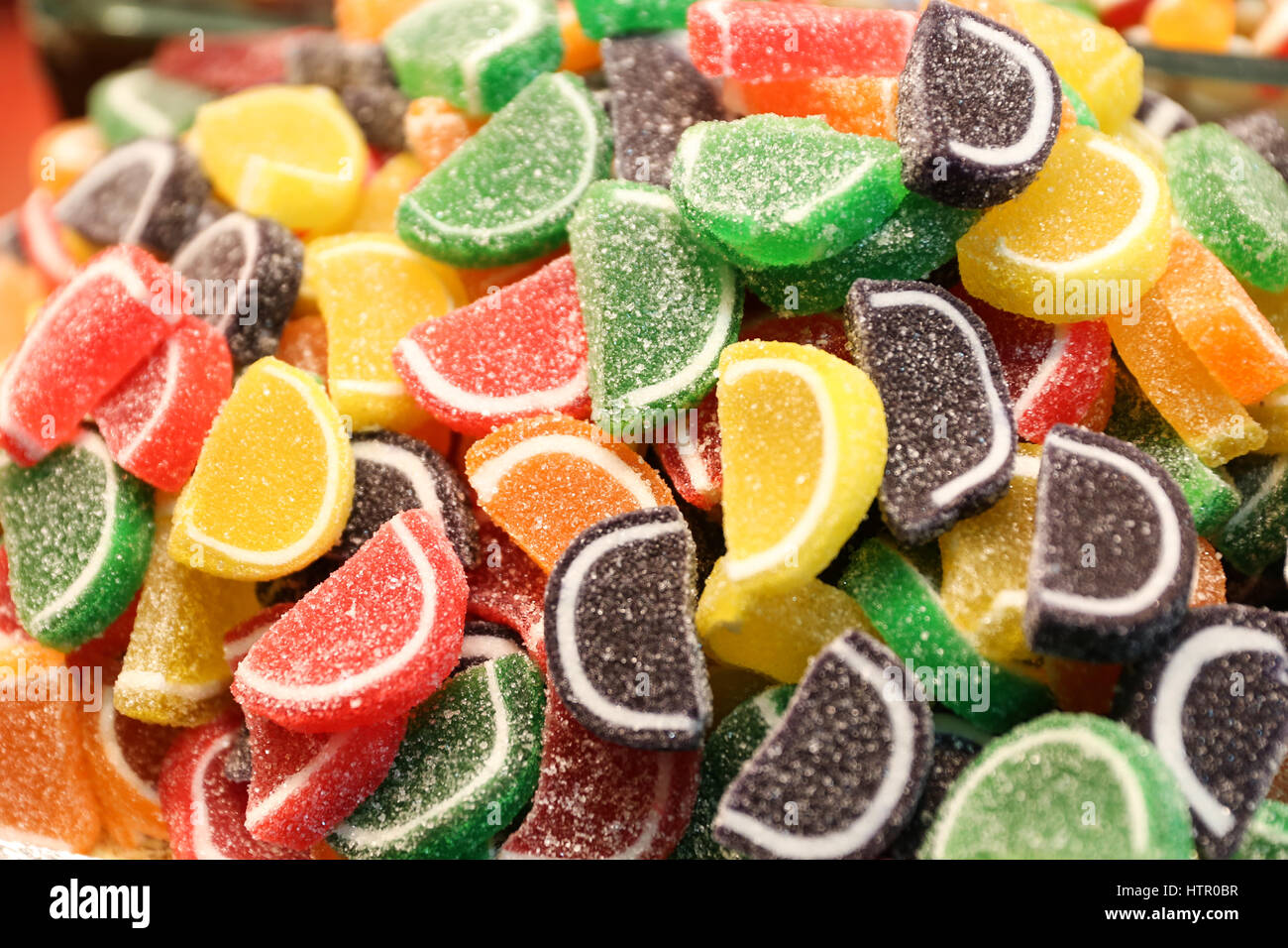Stack of Colorful Sweets in Fruit Shape Stock Photo - Alamy