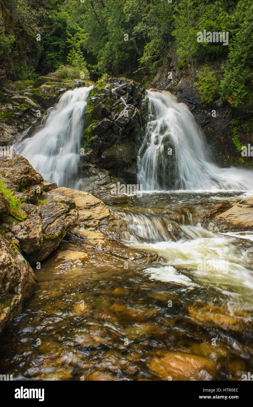 two waterfalls in the forest Stock Photo - Alamy