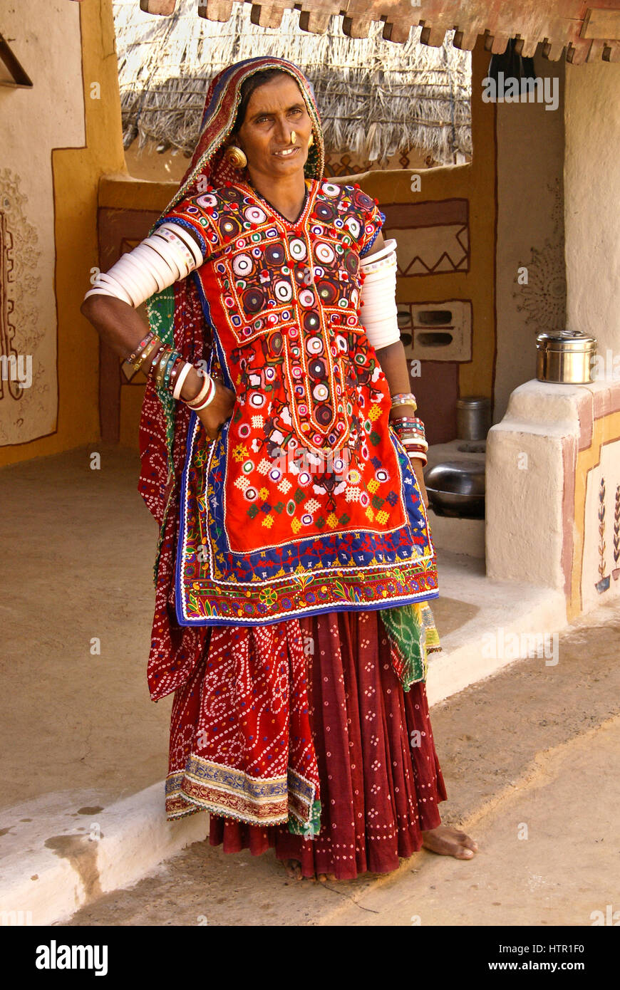 Beautifully dressed Meghwal Harijan woman outside her home in Ludia ...