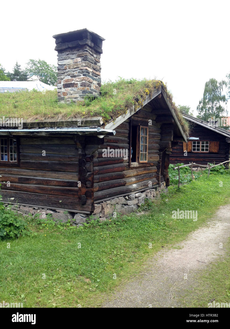 Traditional wooden hut with grass roof in Oslo, Norway. Vernacular ...