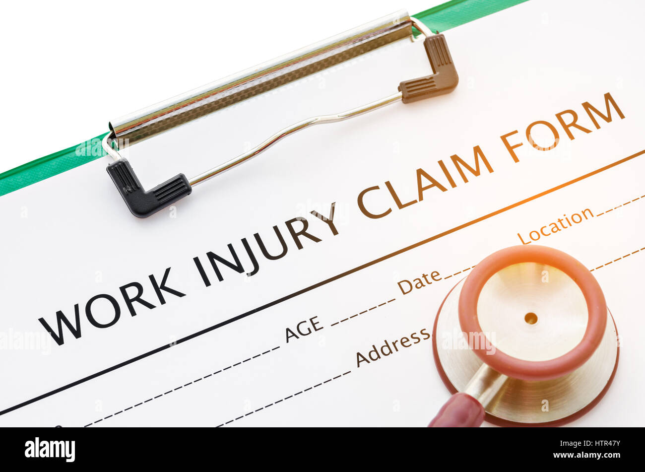Claim form for an injury at work with stethoscope Stock Photo - Alamy