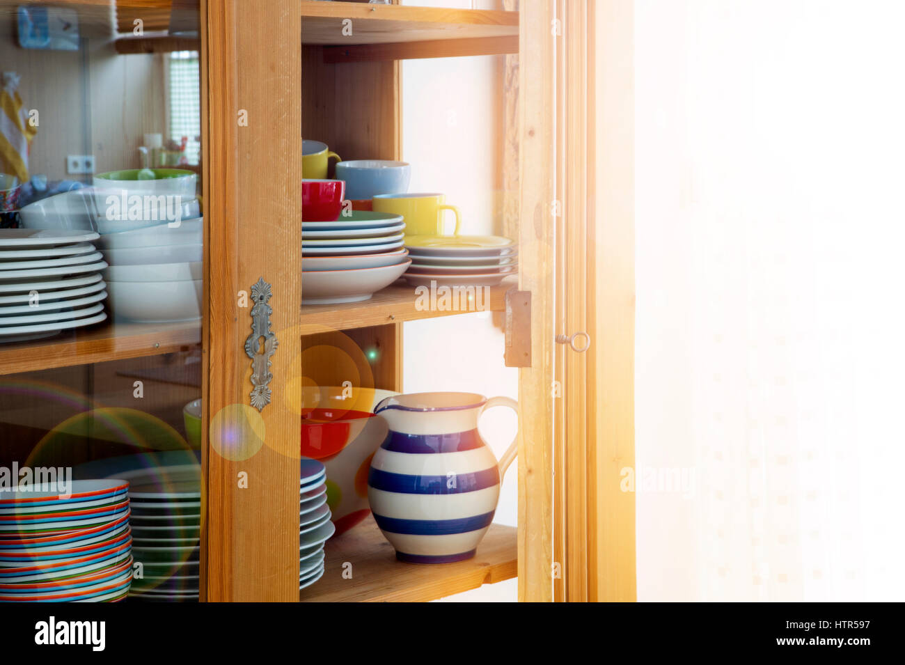 closeup of vintage cabinet with plates and bowls Stock Photo - Alamy