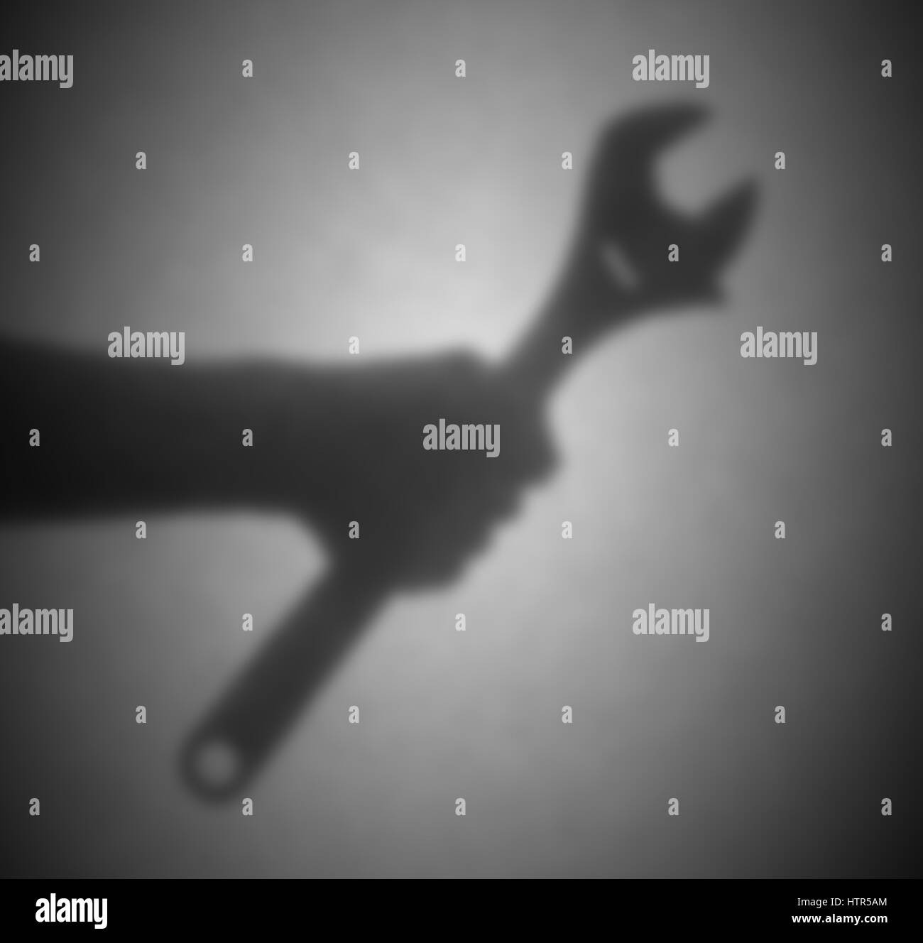 Silhouette behind a transparent paper - Blurred - English wrench Stock ...