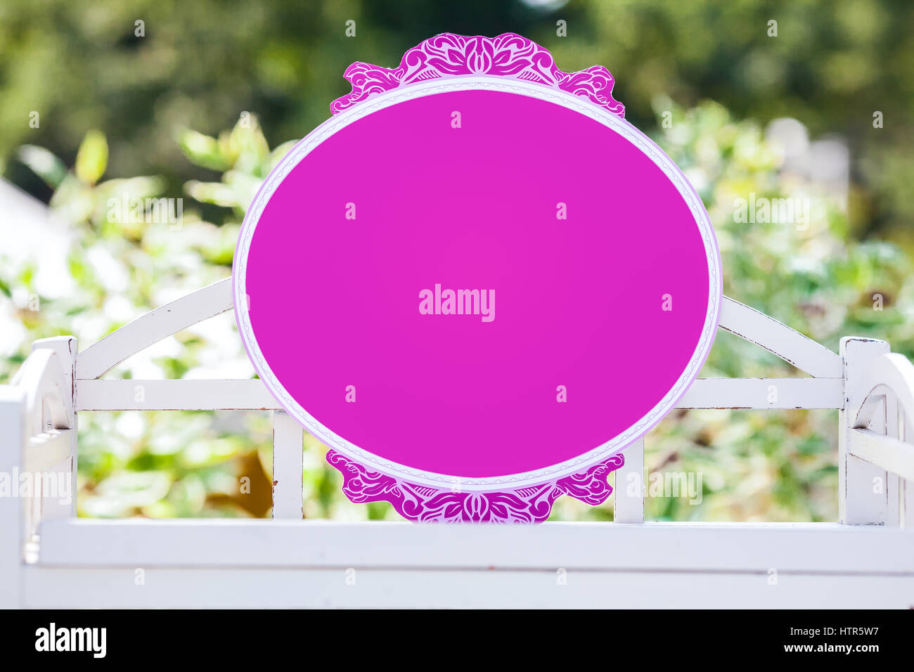 Purple oval frame standing on the shelf Stock Photo - Alamy
