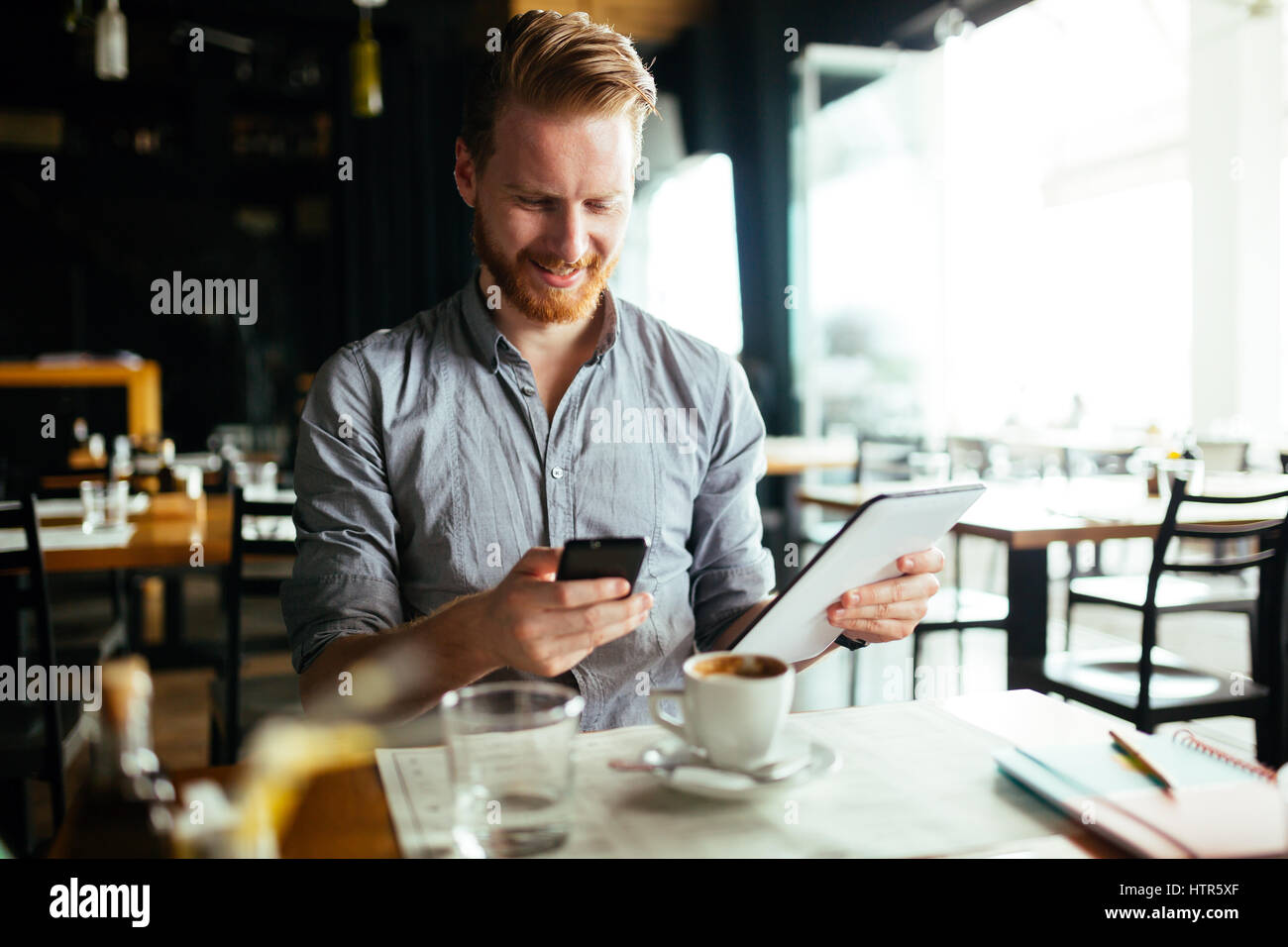 Businessman constantly busy and working Stock Photo - Alamy
