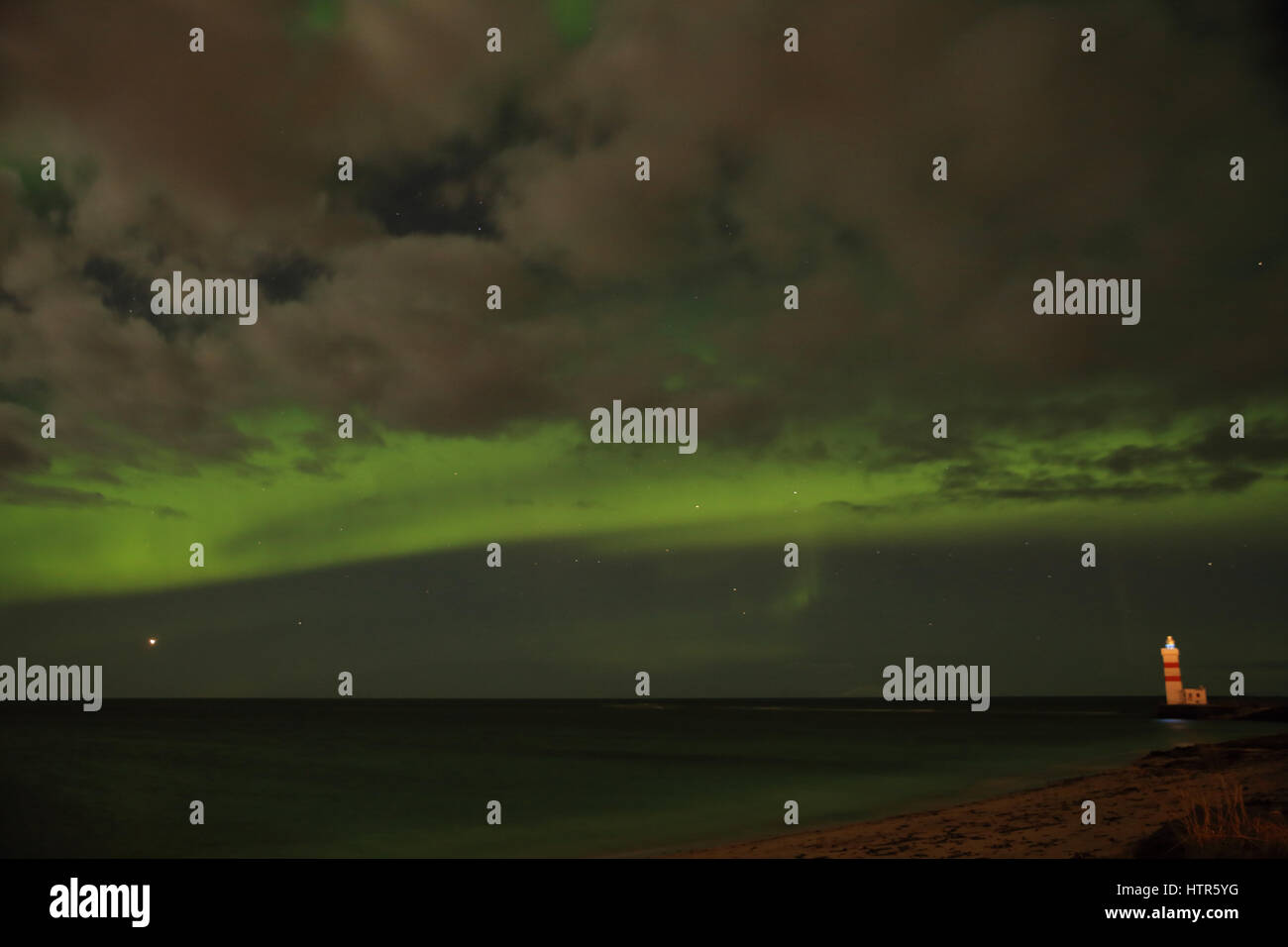 Aurora above the lighthouse on Gardskagi, Keflavik, Iceland Stock Photo ...