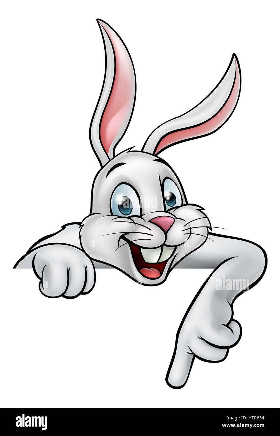 A cartoon white Easter bunny or rabbit pointing Stock Photo - Alamy