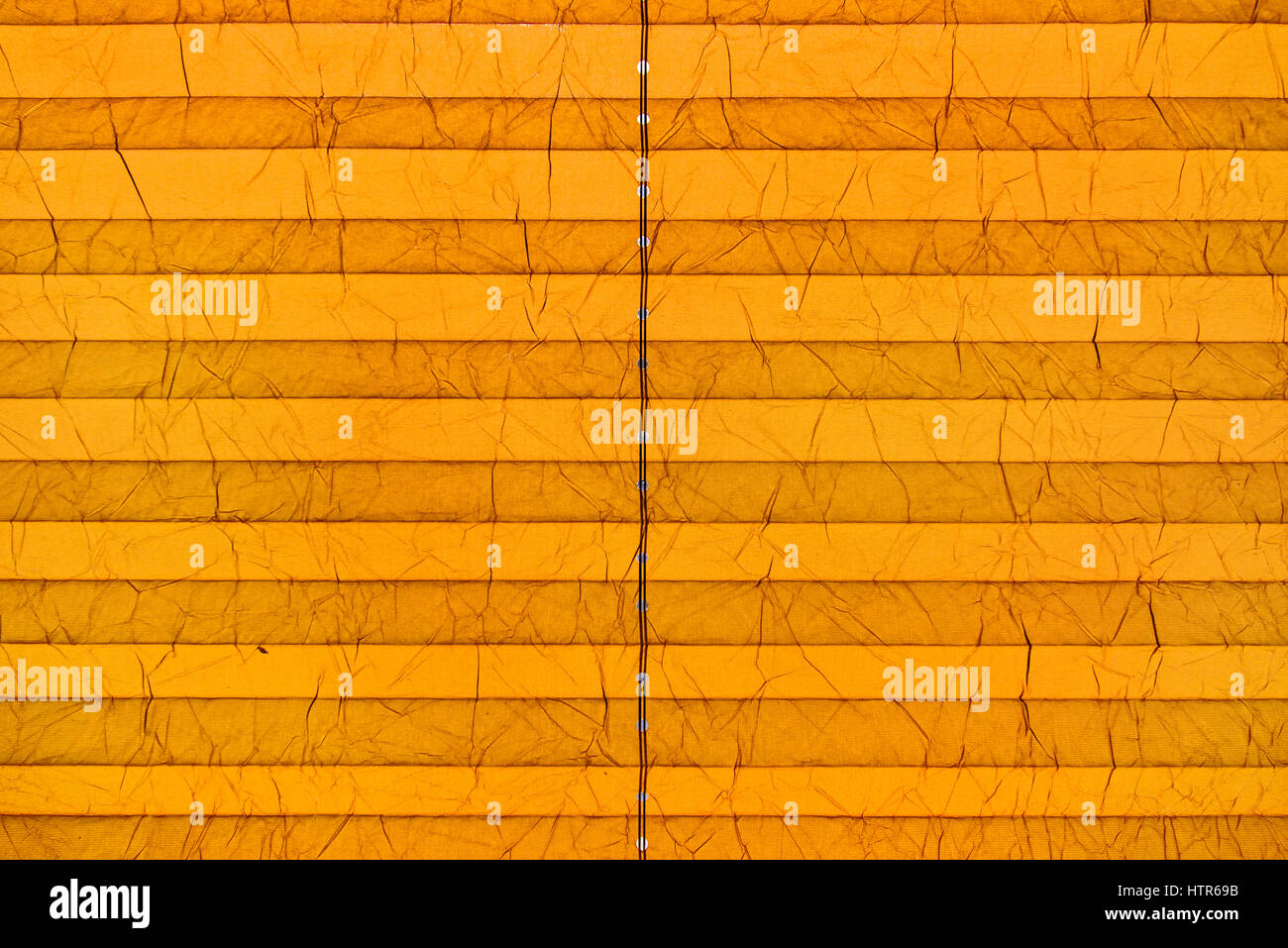 Yellow paper curtain shades for living room window Stock Photo - Alamy
