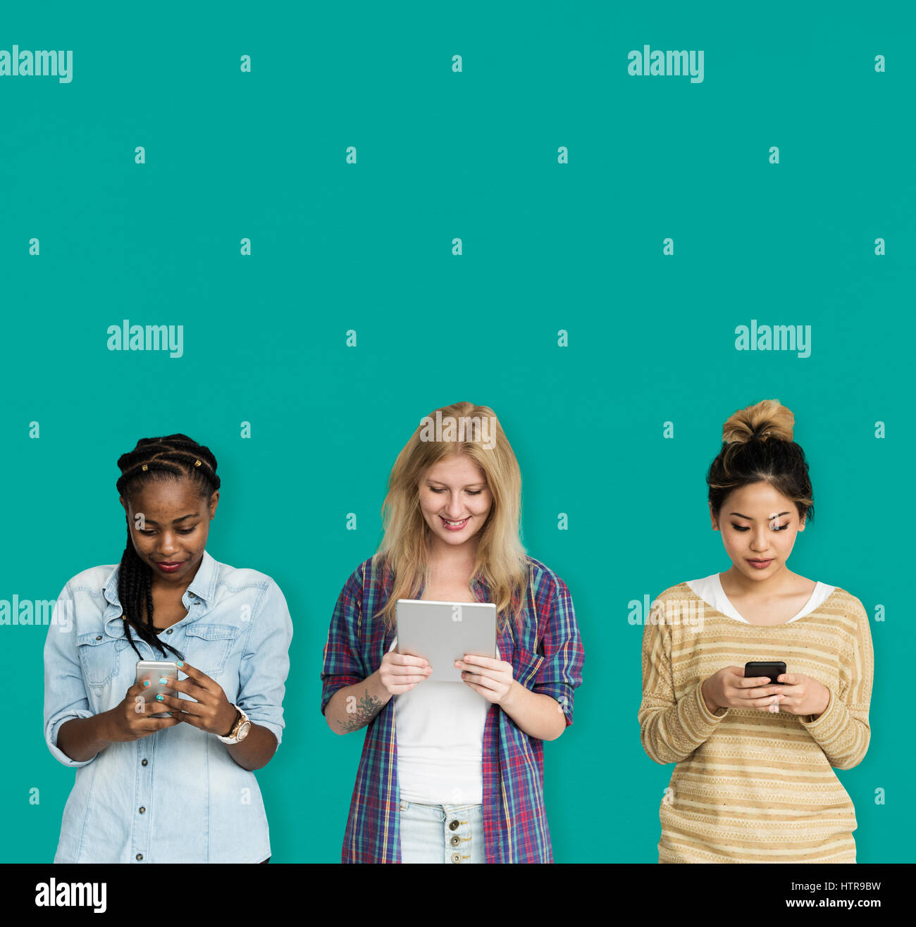 Group of Girls Using Technology Gadgets Stock Photo - Alamy