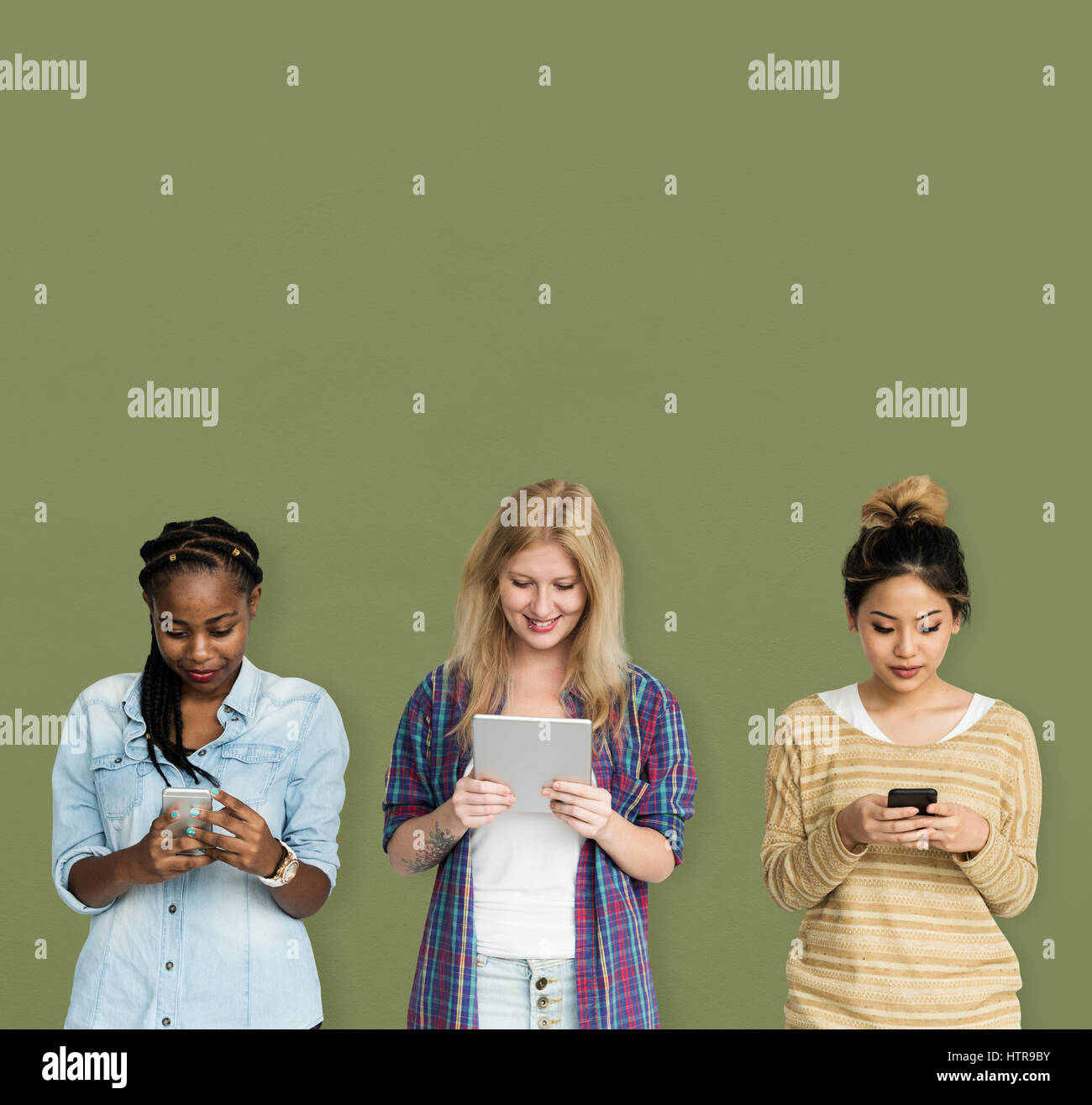 Group of Girls Using Technology Gadgets Stock Photo - Alamy
