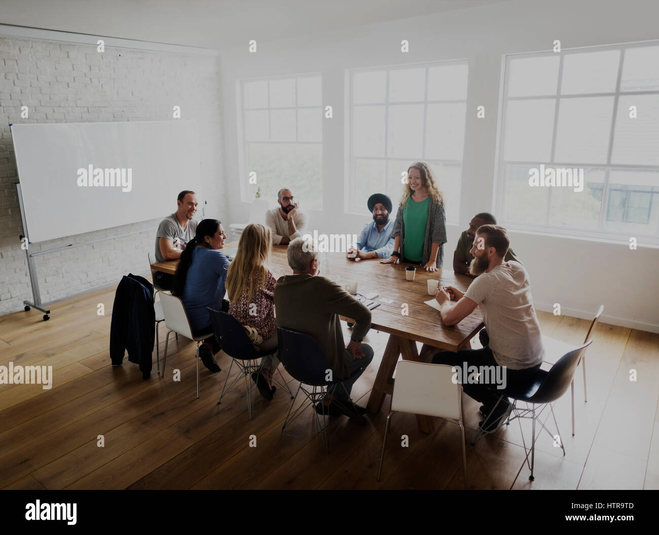 Diverse people teamwork on meeting table Stock Photo - Alamy