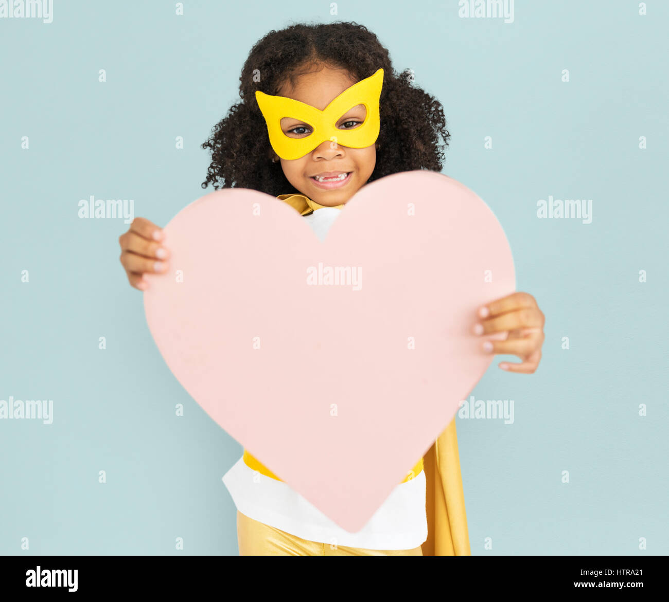 Superhero Kid Carrying Heart Concept Stock Photo - Alamy