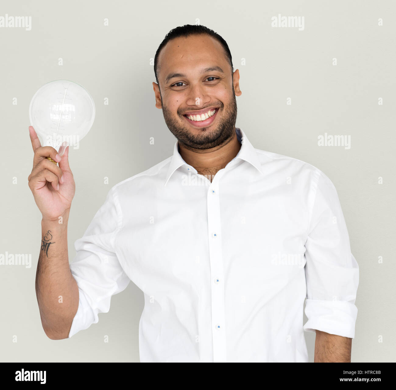 Indian Business Man Smiling Light Bulb Stock Photo - Alamy
