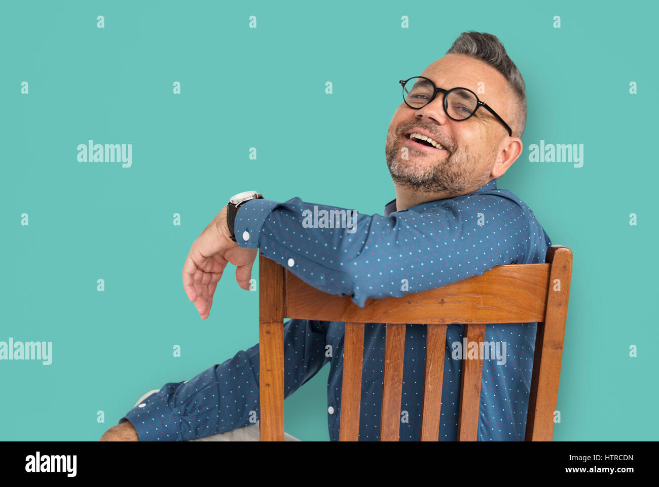 Casual Caucasian Man Sitting Smiling Stock Photo - Alamy