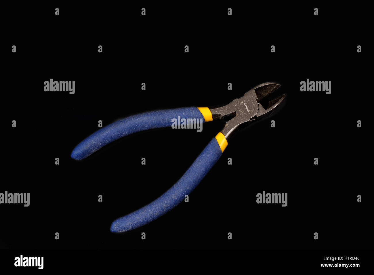 Blue side cutter pliers on a back background Stock Photo - Alamy