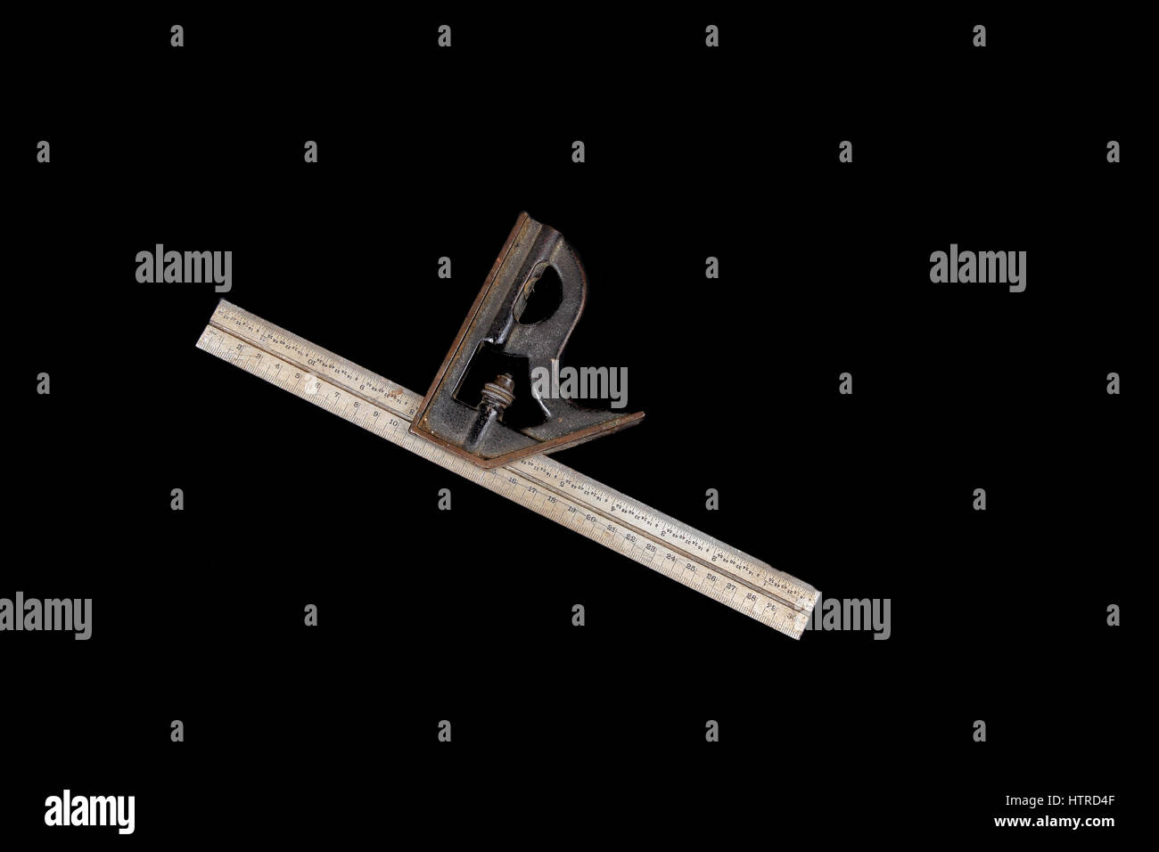 One used combination square isolated on a black background Stock Photo ...