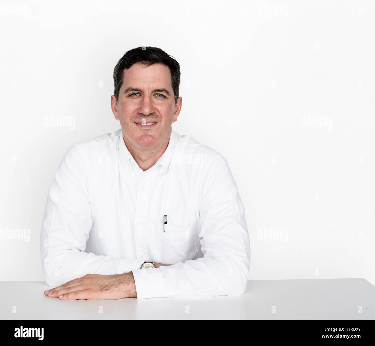 Adult Men Hands On Table Smile Studio Stock Photo - Alamy