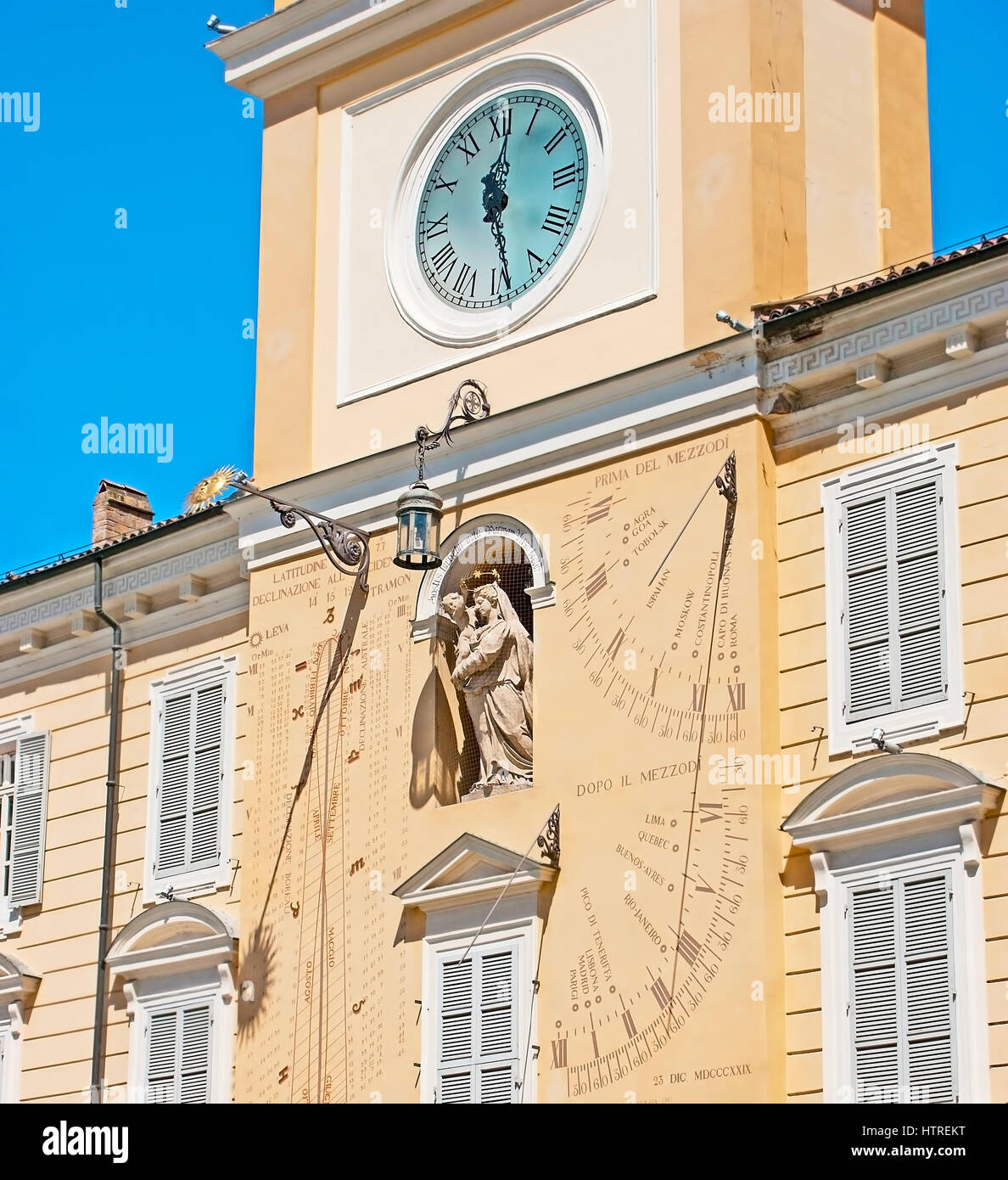 The clock tower of the Governor Palace in Parma decorated with the ...