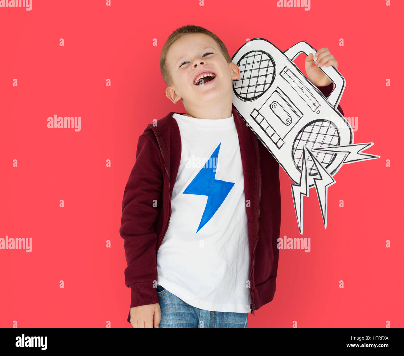 Caucasian Little Boy Holding Jukebox Stock Photo - Alamy