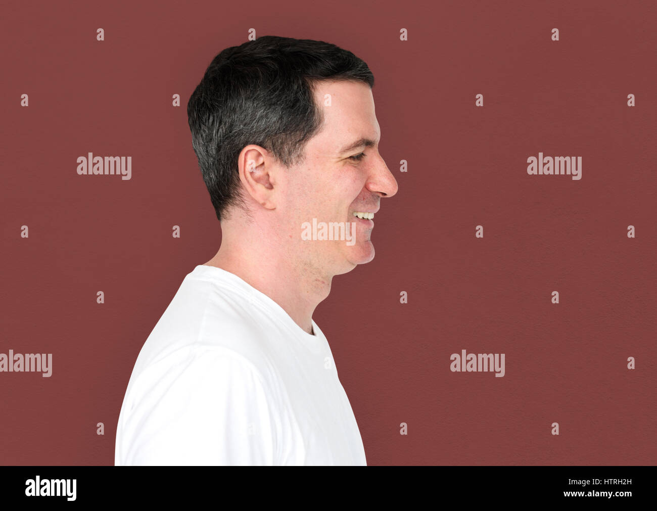Caucasian Man Smiling Happy Side View Stock Photo - Alamy
