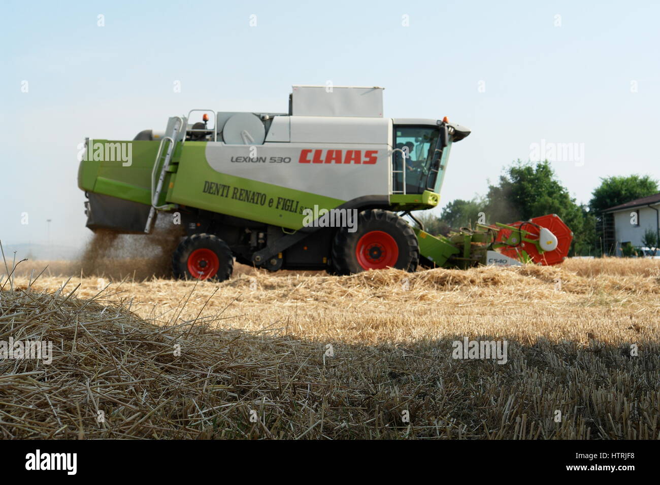 Combine Harvester In Wheat Field: reap, reaping, reaper Stock Photo - Alamy