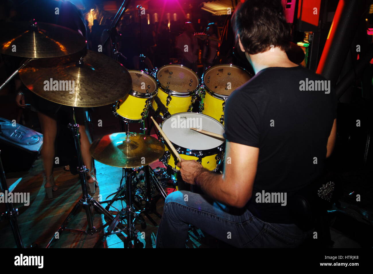 Drummer performing on stage at concert Stock Photo - Alamy