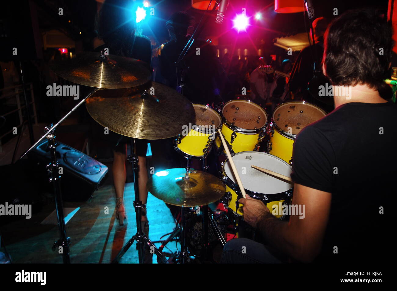 Drummer performing on stage at concert Stock Photo - Alamy