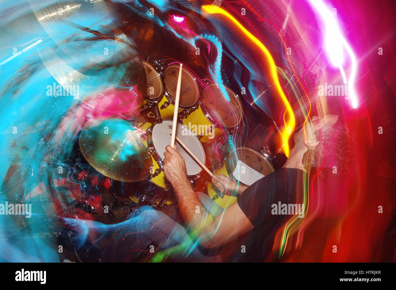 Drummer performing on stage at concert Stock Photo - Alamy