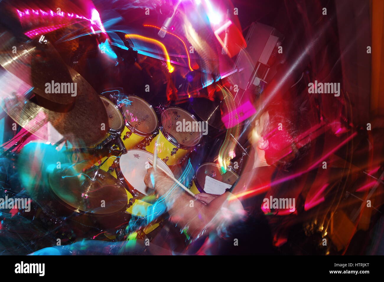 Drummer performing on stage at concert Stock Photo - Alamy
