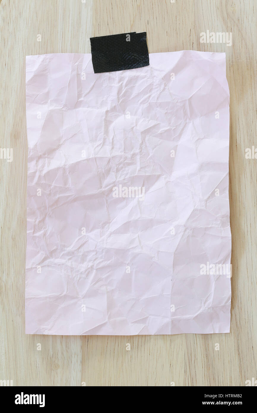Pink notepad paper crumpled of empty and copy space on wooden ...