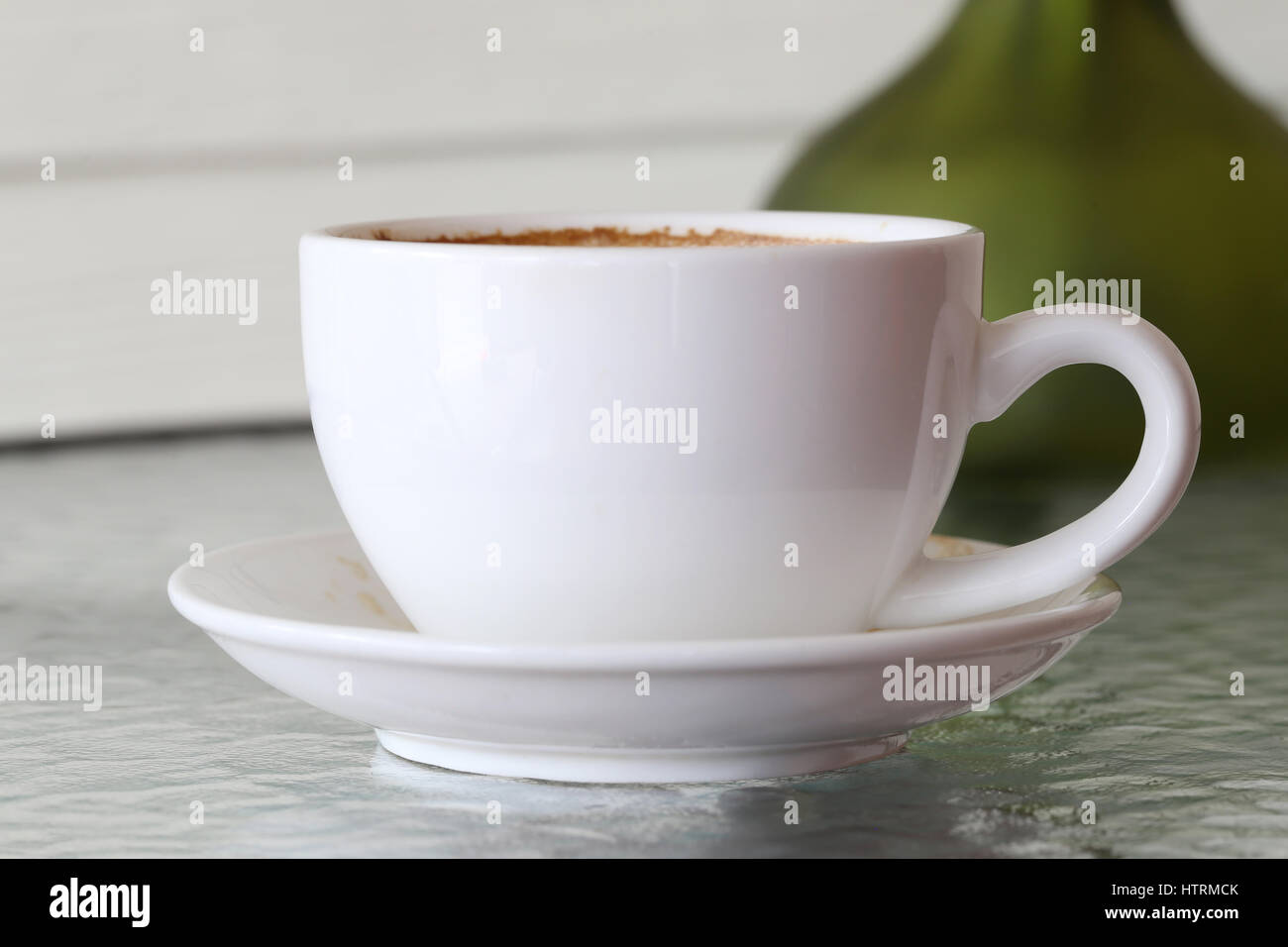 White coffee mug on table in a cafe Stock Photo - Alamy