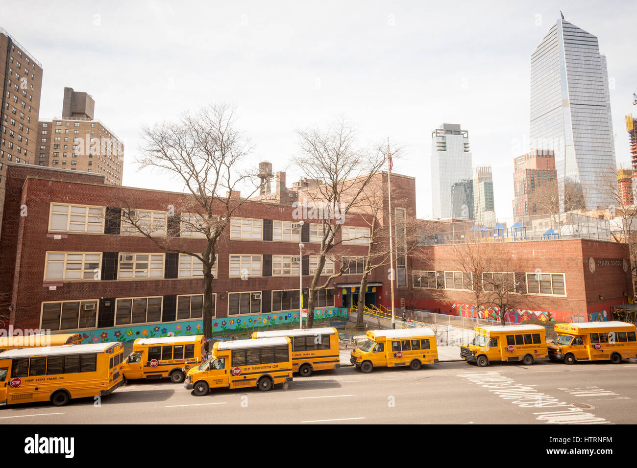 School buses line up in front of PS 33 in Chelsea in New York on Monday ...