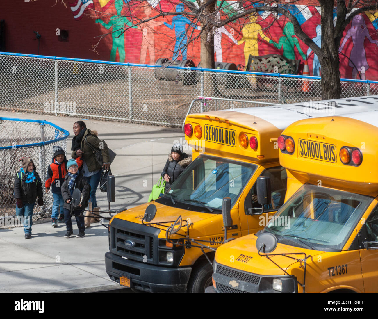 School buses line up in front of PS 33 in Chelsea in New York on Monday ...