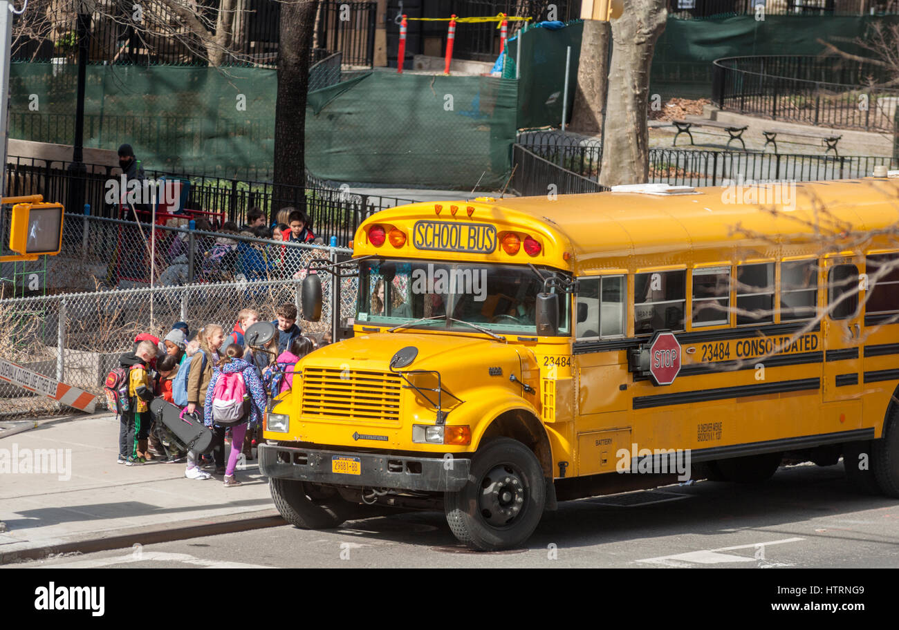 School buses line up in front of PS 33 in Chelsea in New York on Monday ...