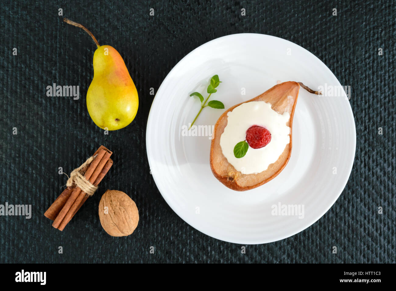 Sweet Baked pear with cream, raspberry syrup, fresh raspberries and ...