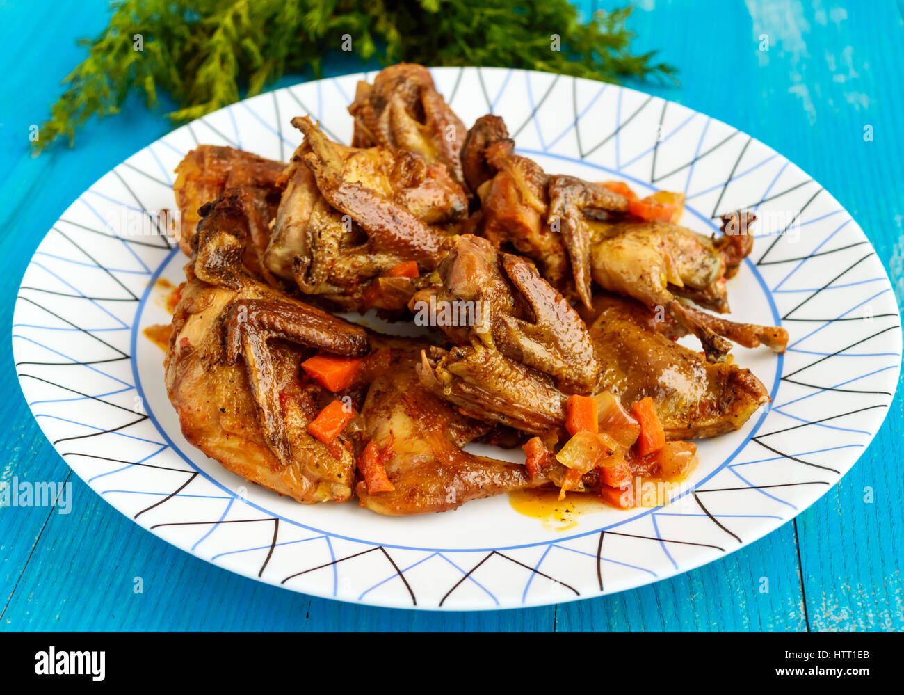 Quail stew with vegetable gravy on a blue wooden table Stock Photo - Alamy