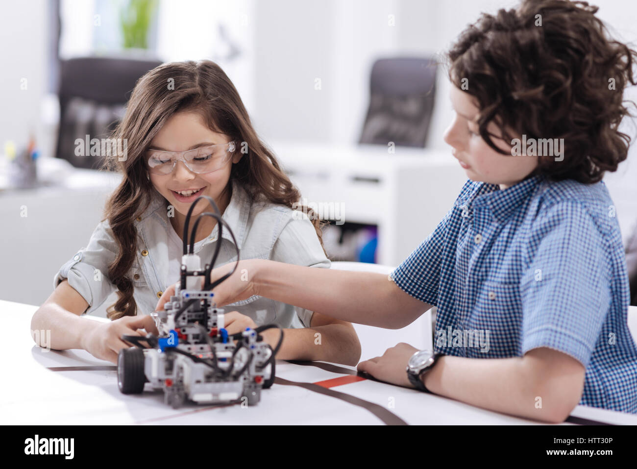 Joyful kids having science class at school Stock Photo - Alamy