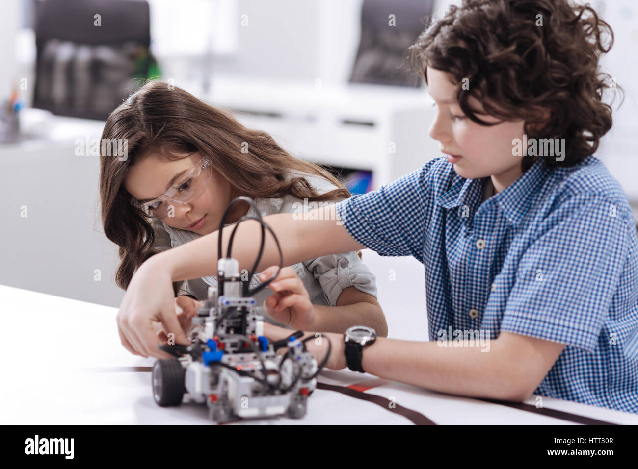 Enthusiastic kids enjoying science class at school Stock Photo - Alamy