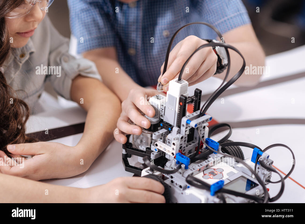 Concentrated pupils testing electronic robot in the laboratory Stock ...