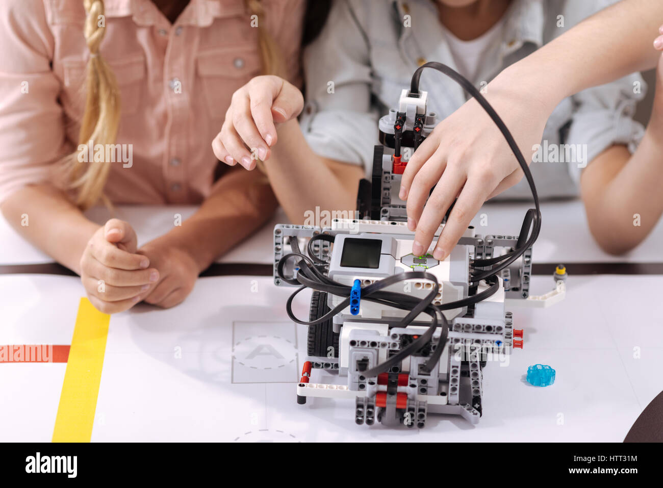 Skillful children testing robot at school Stock Photo - Alamy