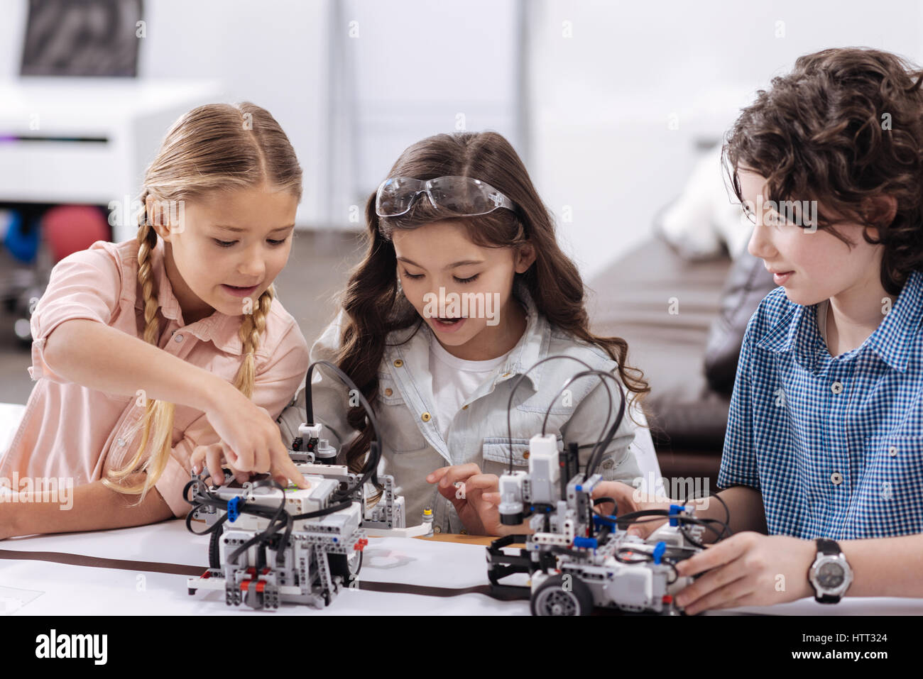 Enthusiastic kids enjoying discussion at school Stock Photo - Alamy