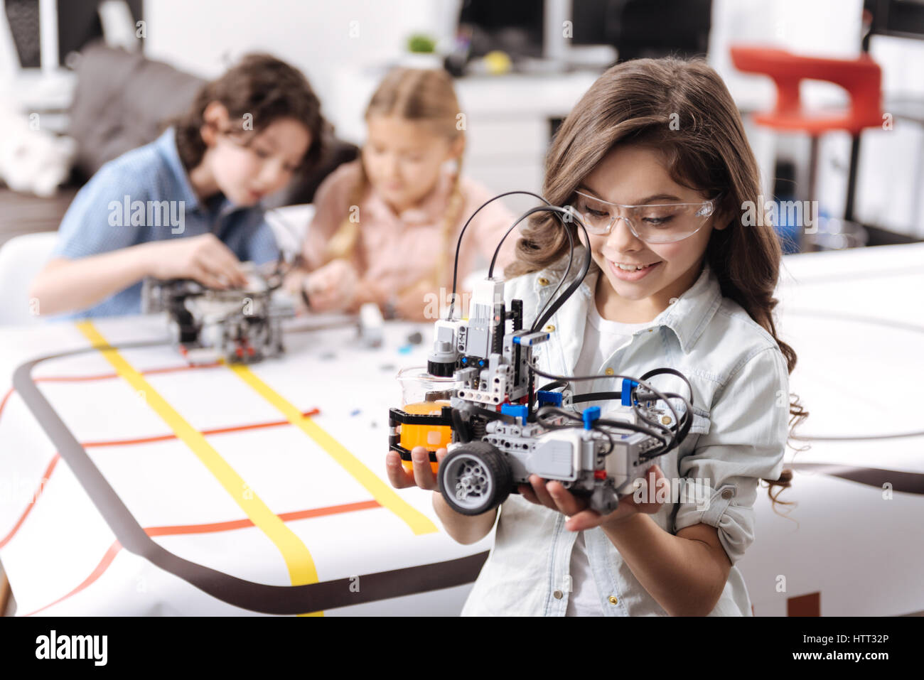 Joyful girl representing project at school Stock Photo - Alamy