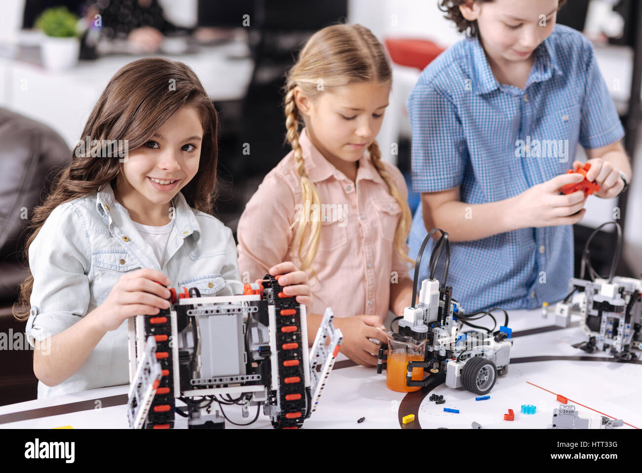 Hilarious school children enjoying science lesson at school Stock Photo ...