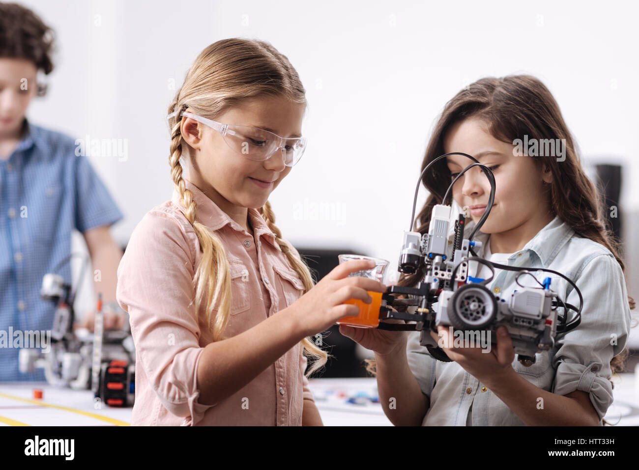 Inventive pupils conducting science experiment at school Stock Photo ...